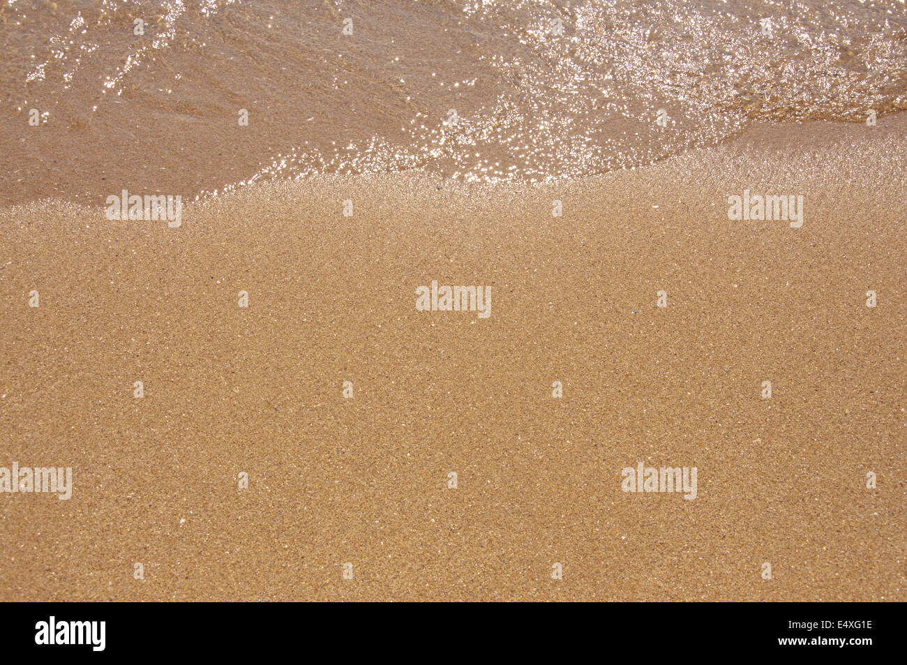 Sand and water on the beach Stock Photo - Alamy