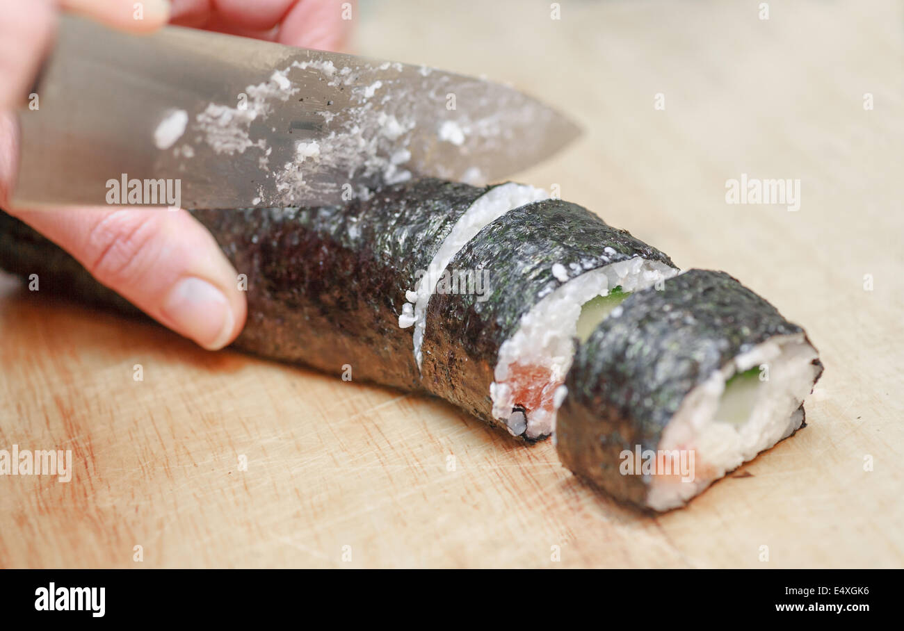 Cutting sushi hi-res stock photography and images - Alamy
