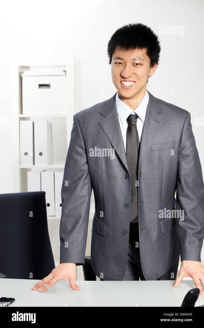 Asian business man standing Stock Photo - Alamy