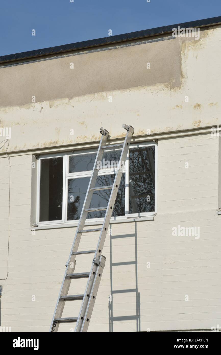 Ladder leaning against wall hi-res stock photography and images - Alamy