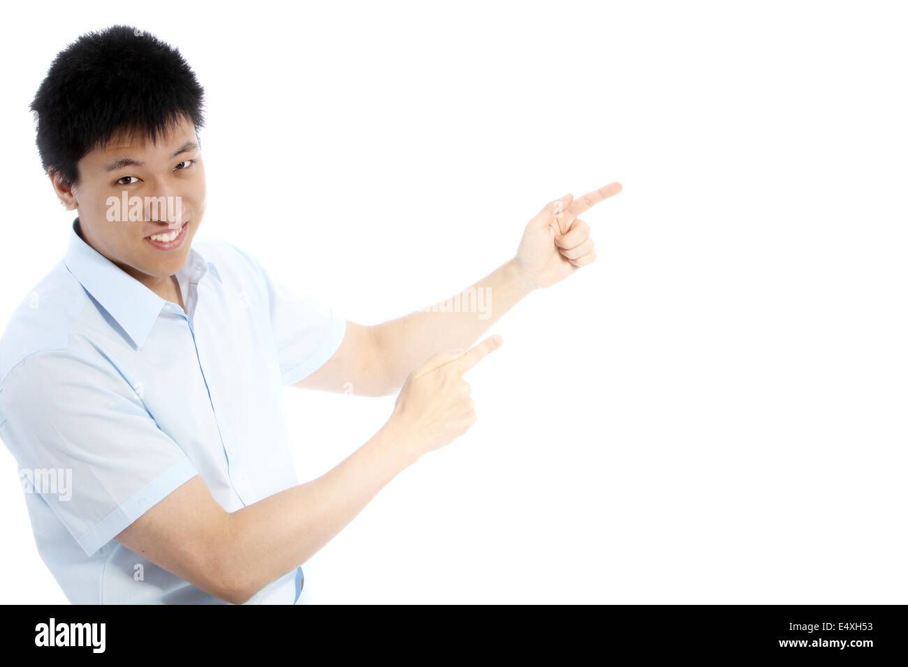 Asian man pointing with both hands Stock Photo - Alamy