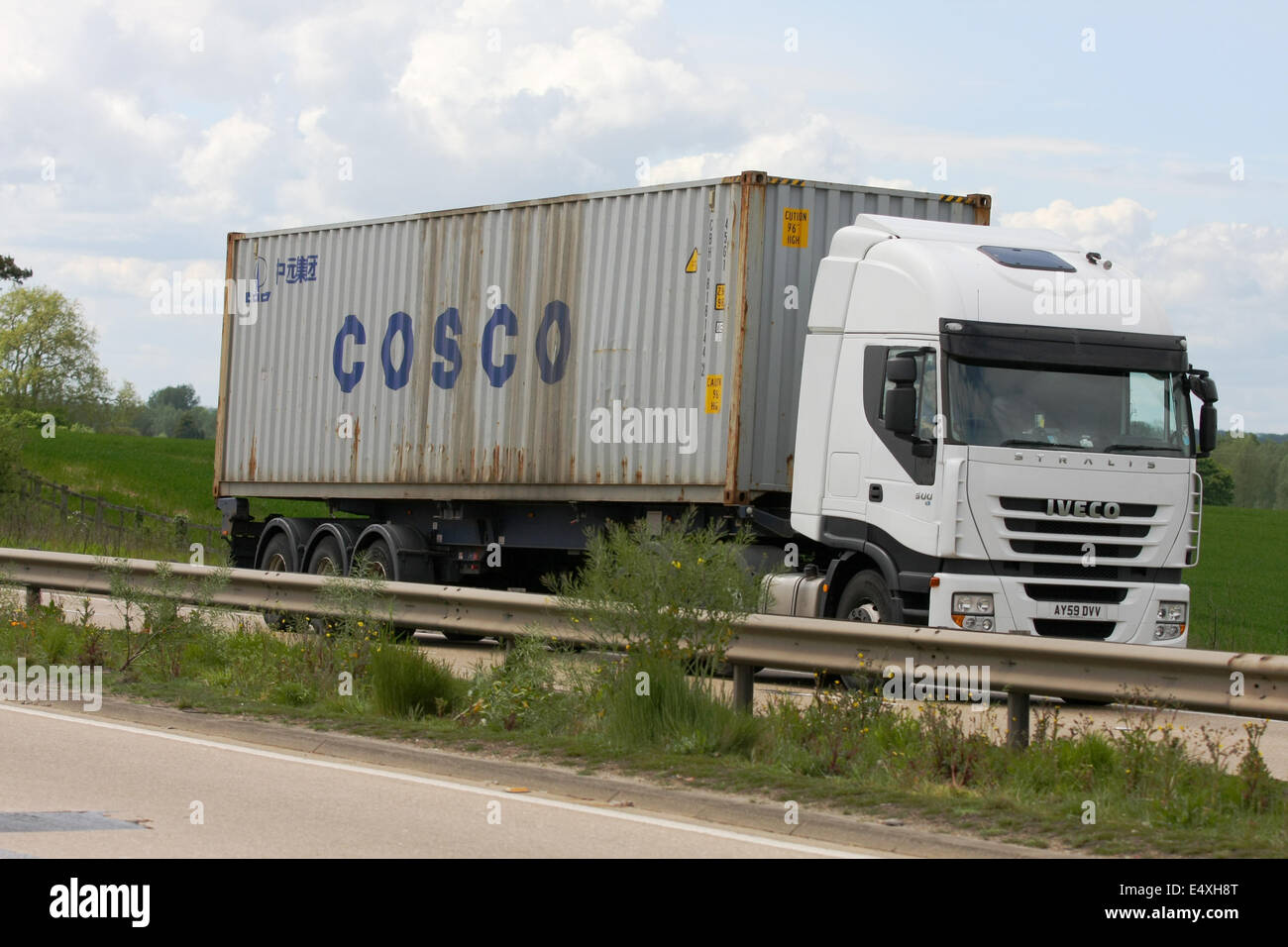 An Iveco truck hauling a COSCO shipping container along the A12 dual ...