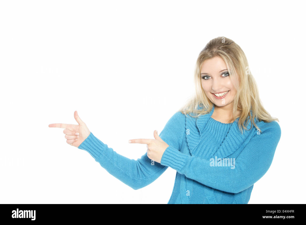 Woman pointing with both hands Stock Photo - Alamy