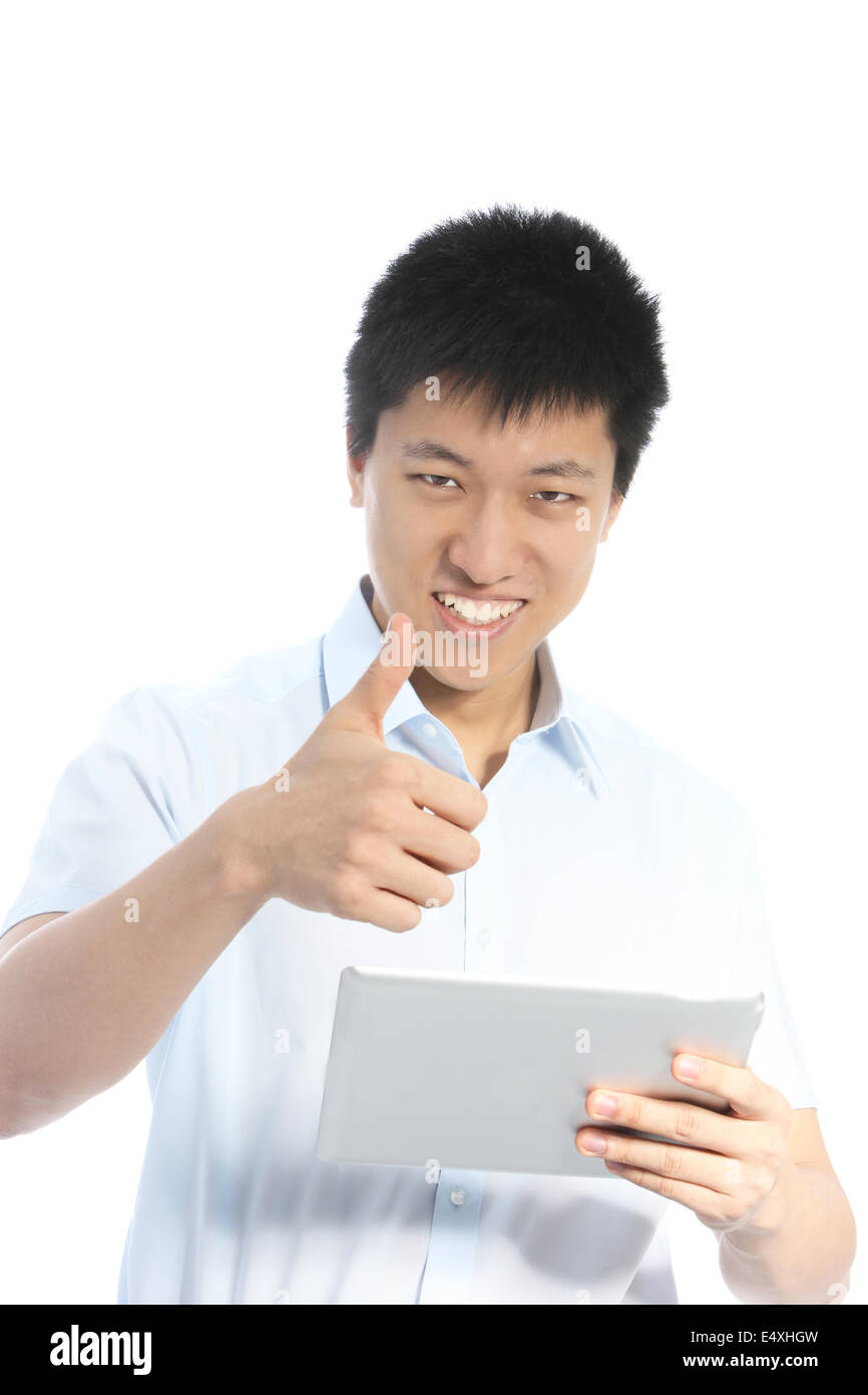 Smiling Asian man giving a thumbs up Stock Photo - Alamy