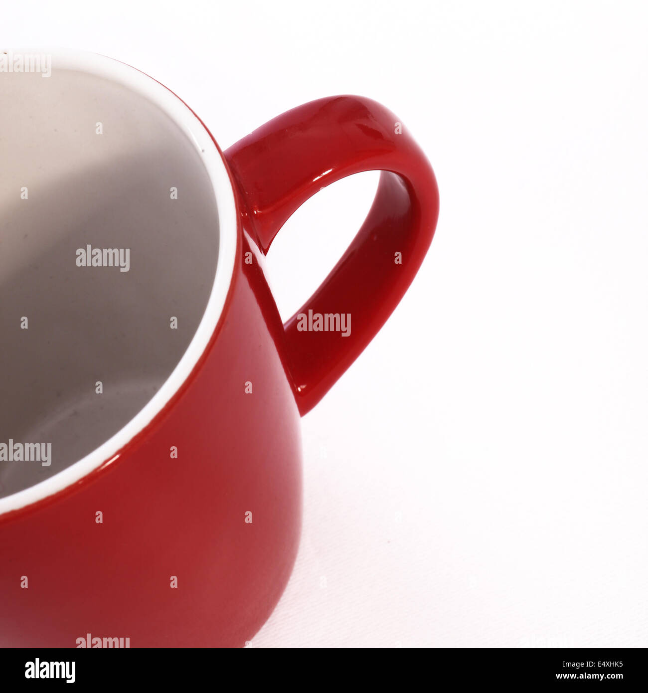 Looking inside an empty coffee mug Stock Photo - Alamy