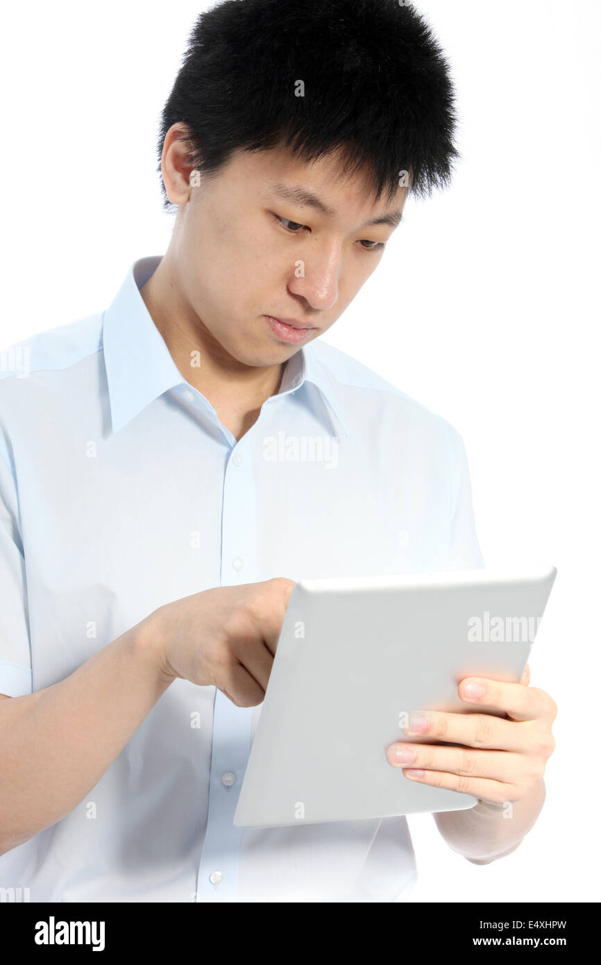 Serious asian young man tablet hi-res stock photography and images - Alamy
