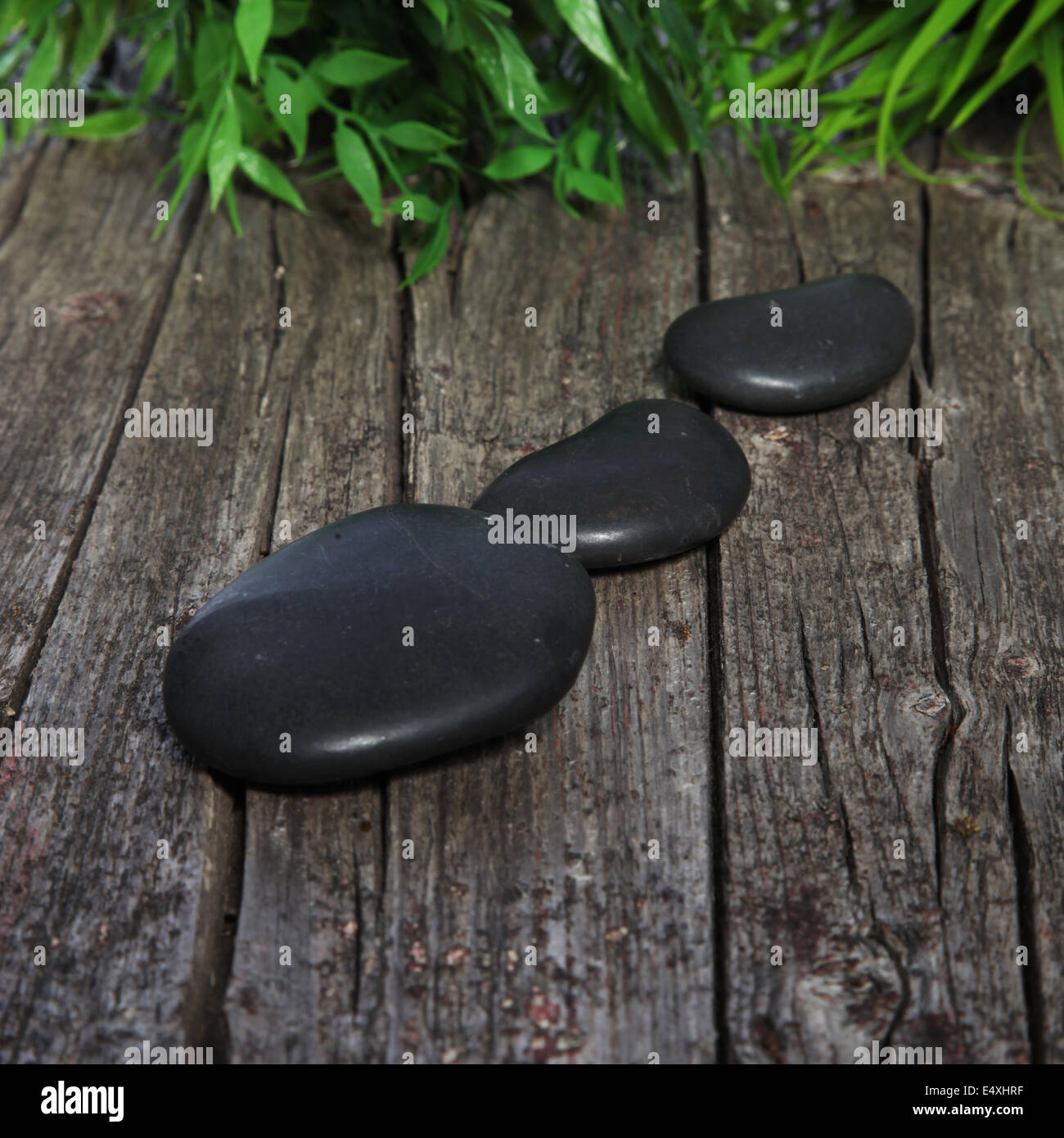 Smooth black basalt spa stones Stock Photo - Alamy