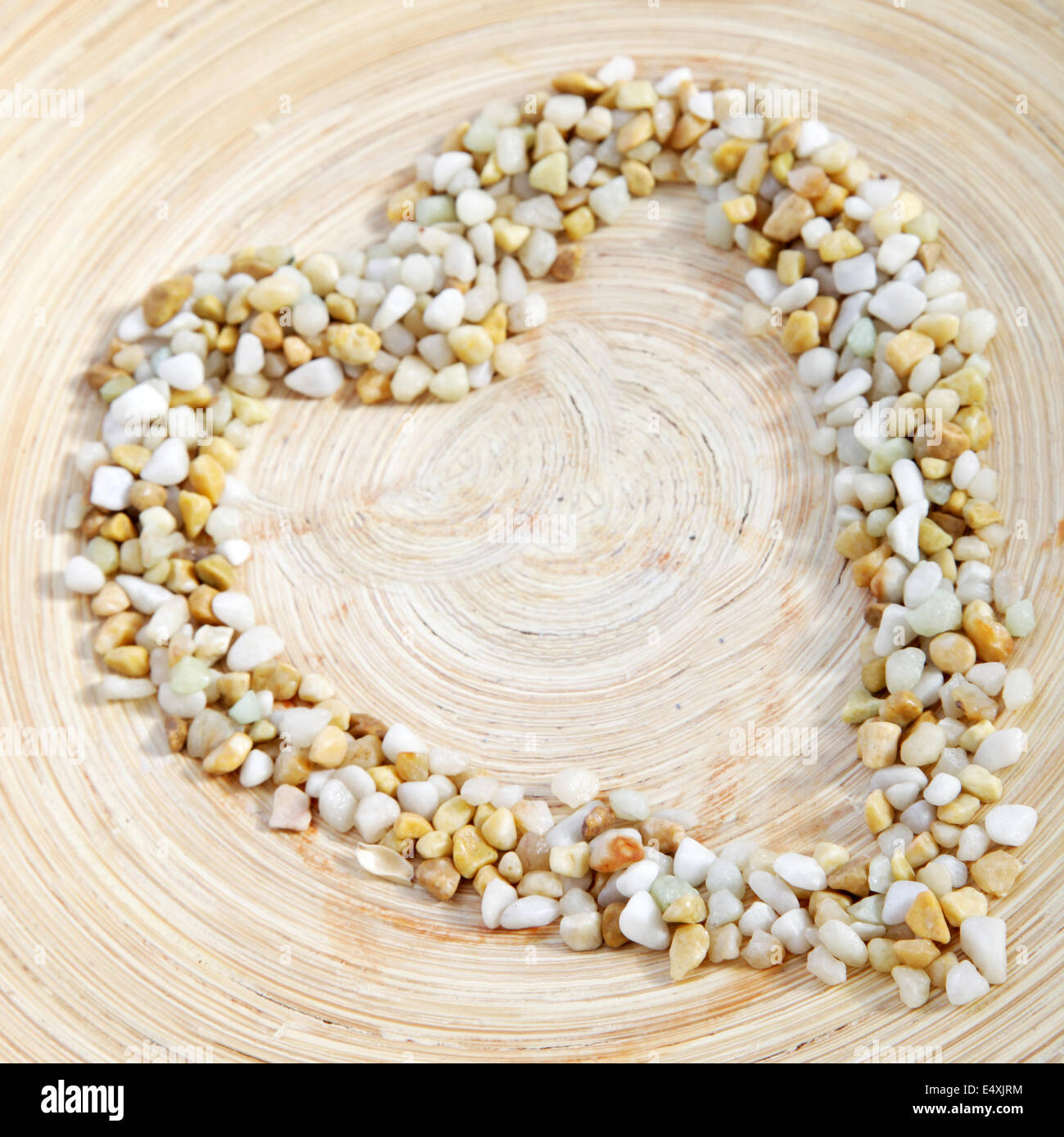Pebble heart on earthenware Stock Photo - Alamy