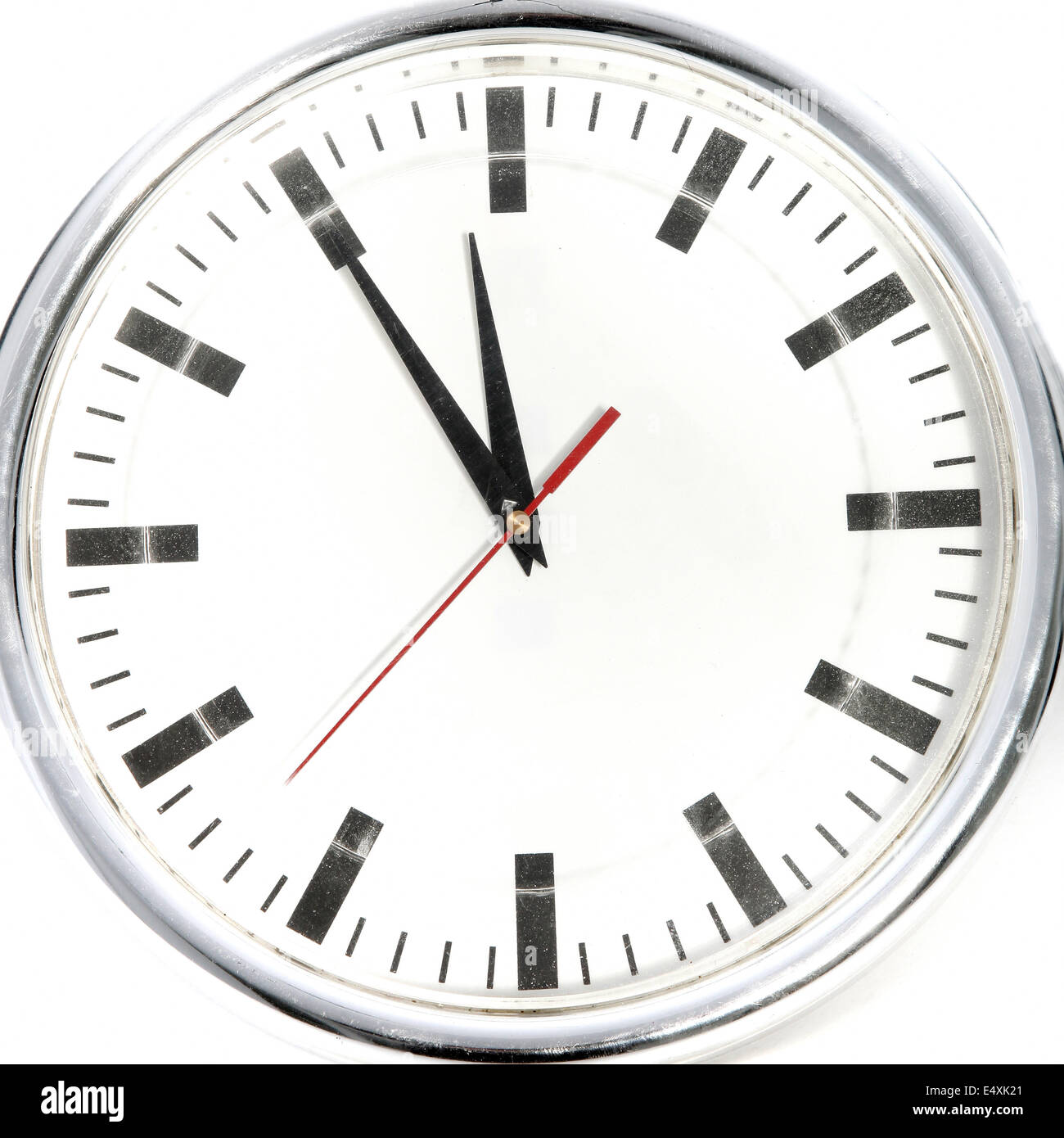 Clock showing five to twelve Stock Photo - Alamy