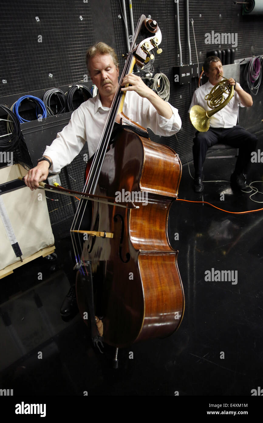 Boston Landmarks Orchestra musicians practice before a rehearsal in a ...