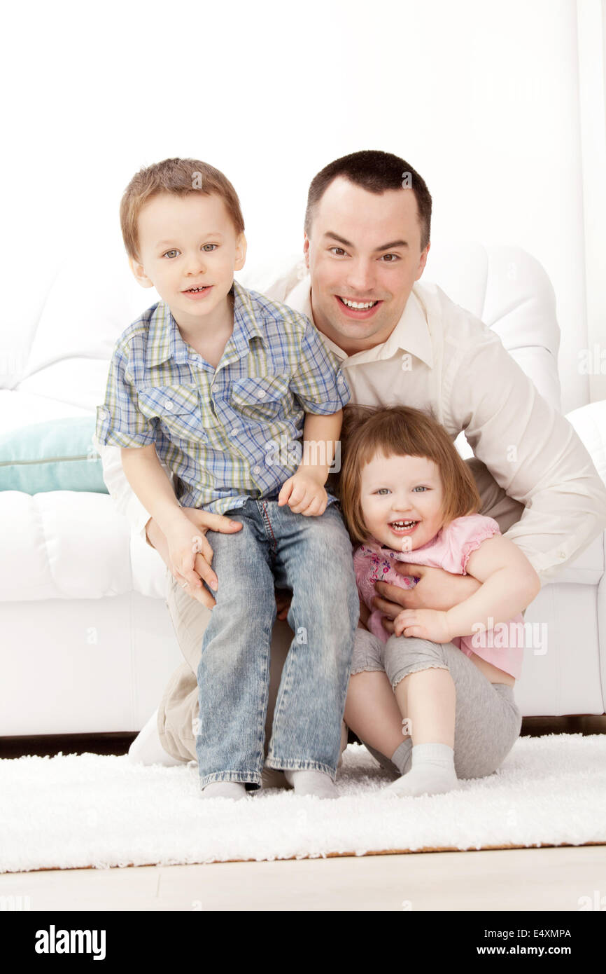 Portrait of a happy young guy with kids Stock Photo - Alamy