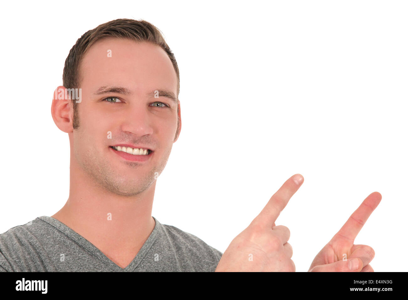Smiling young man pointing upwards Stock Photo - Alamy Smiling young man pointing upwards Stock Photo - Alamy