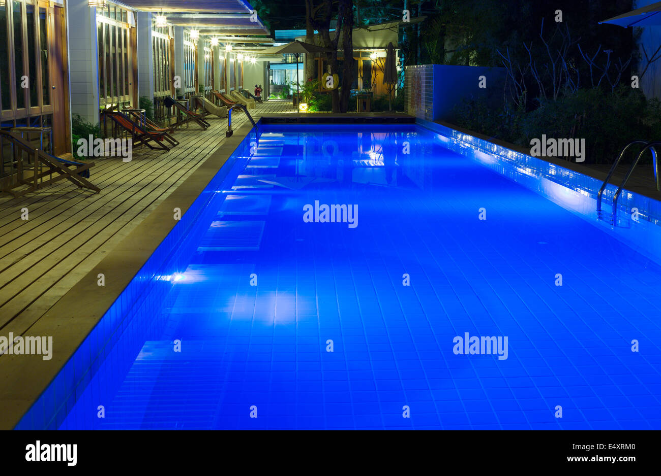 Pool and garden by night Stock Photo - Alamy