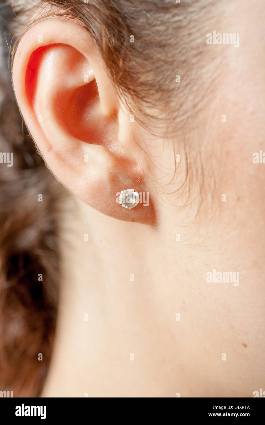 Young caucasian woman ear closeup Stock Photo - Alamy
