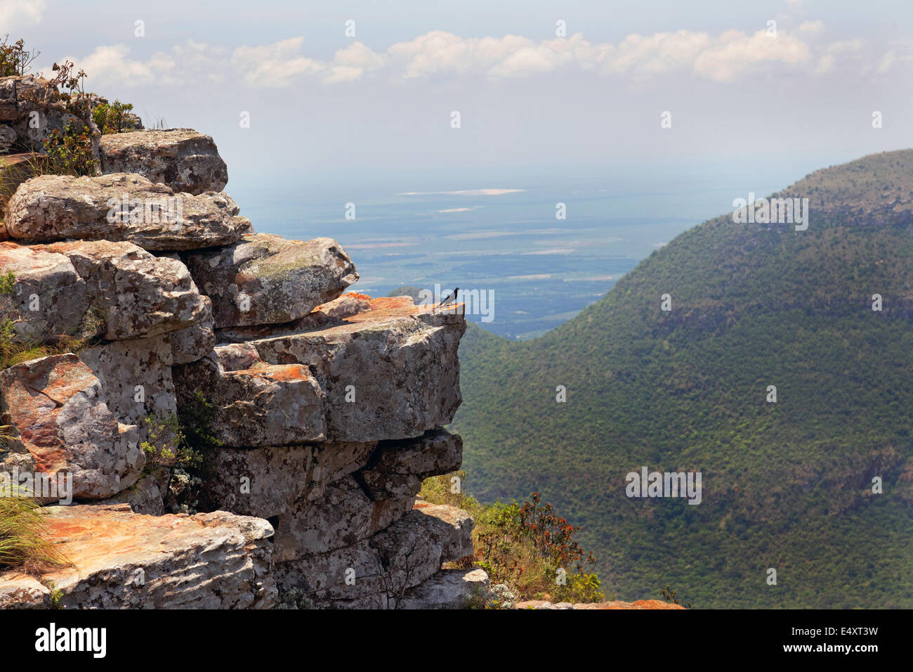 Rocky ledge overlooking a mountain valley Stock Photo - Alamy