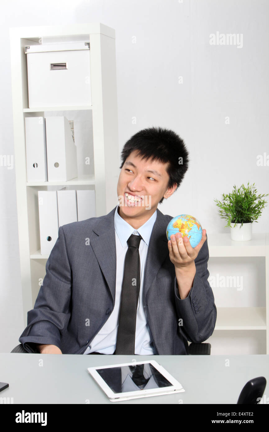 Asian man holding globe hi-res stock photography and images - Alamy Asian man holding globe hi-res stock photography and images - Alamy