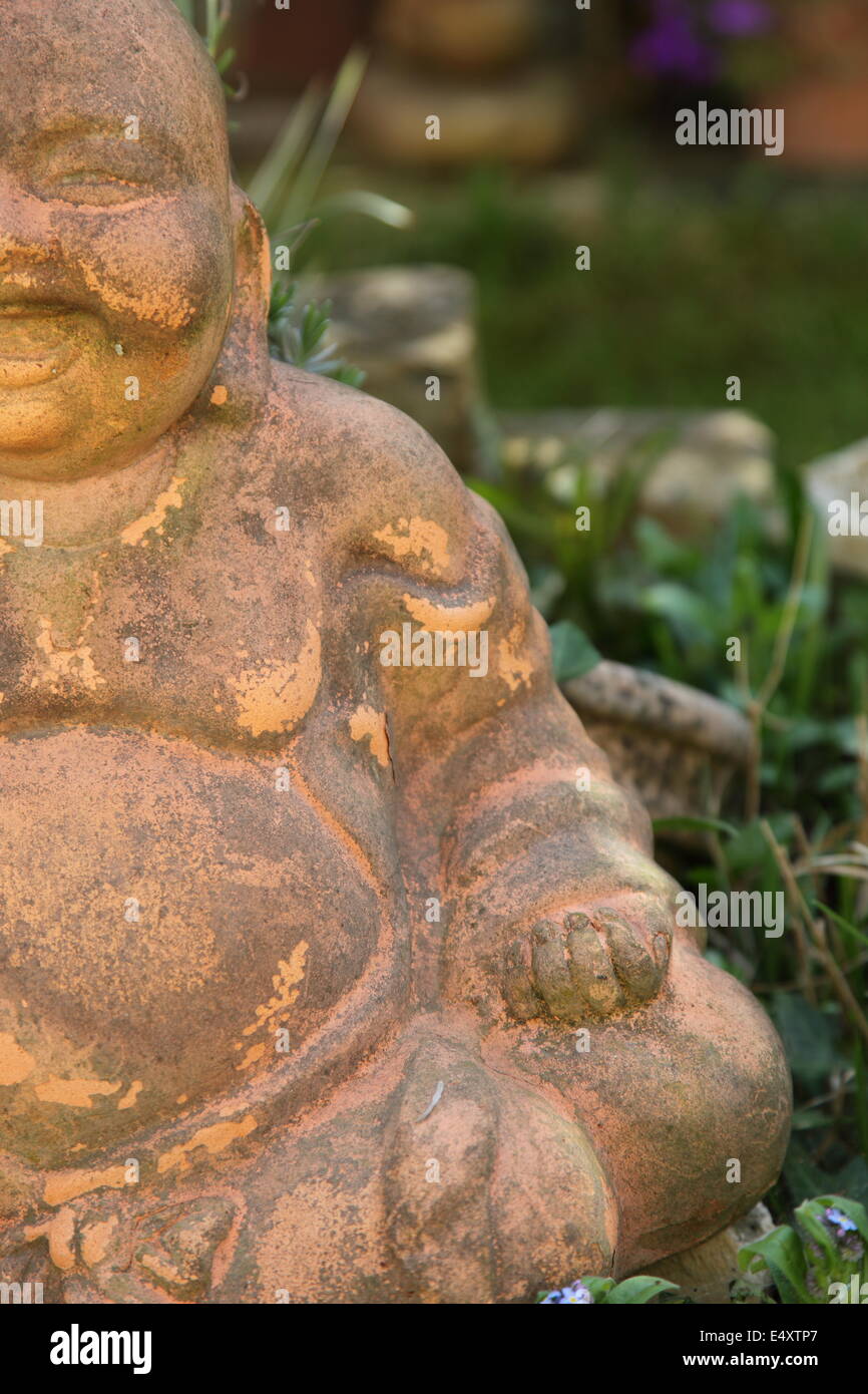 Smiling Buddha figurine Stock Photo - Alamy