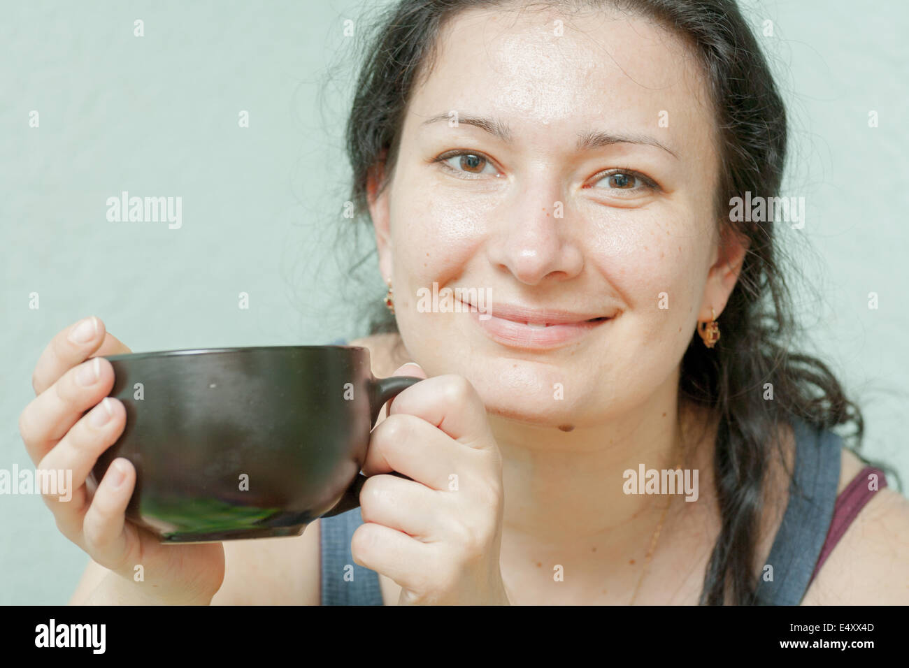 woman smiling drinking tea smile Stock Photo - Alamy
