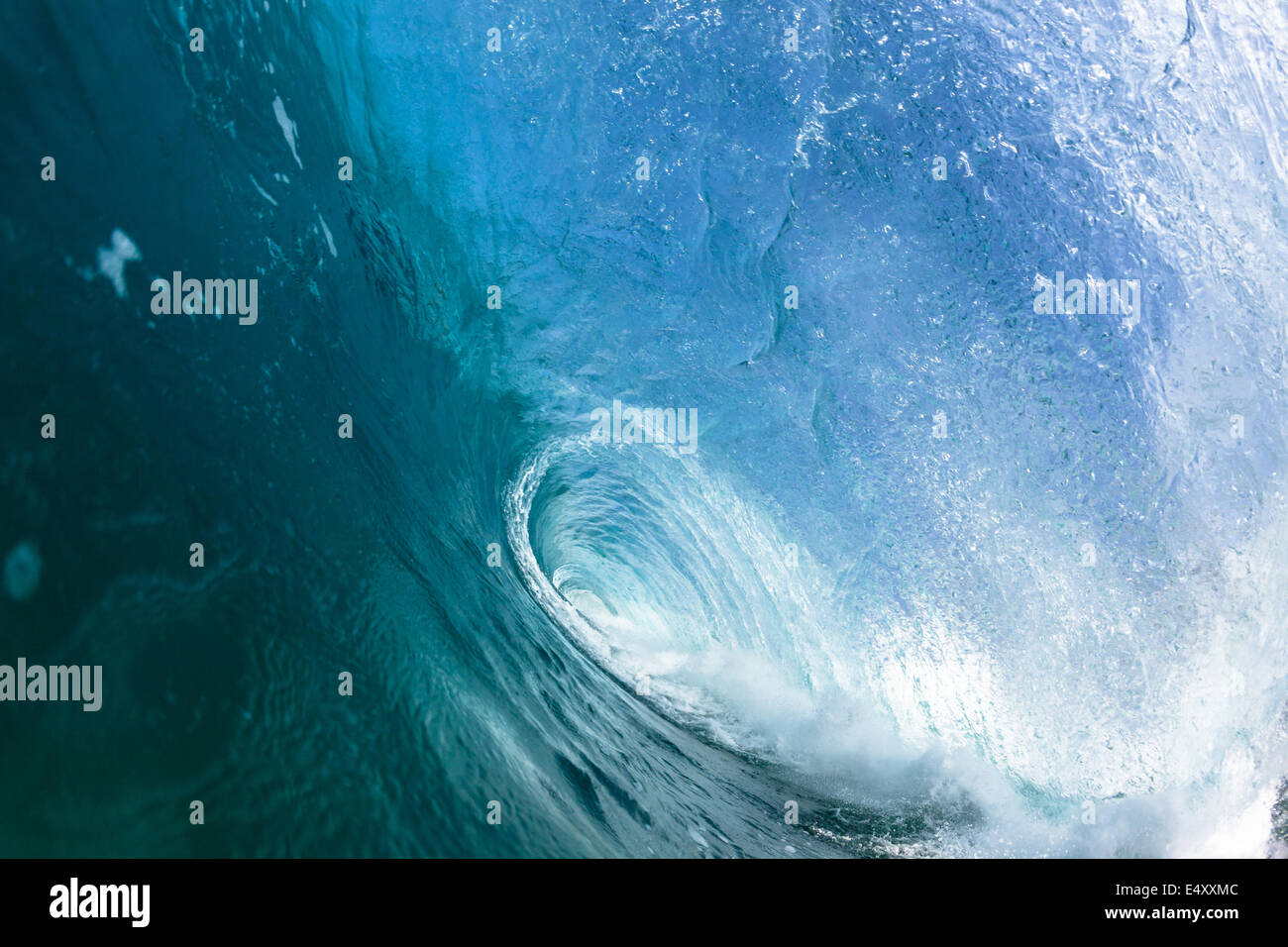 Ocean blue hollow wave crashing breaking power and energy along beach ...