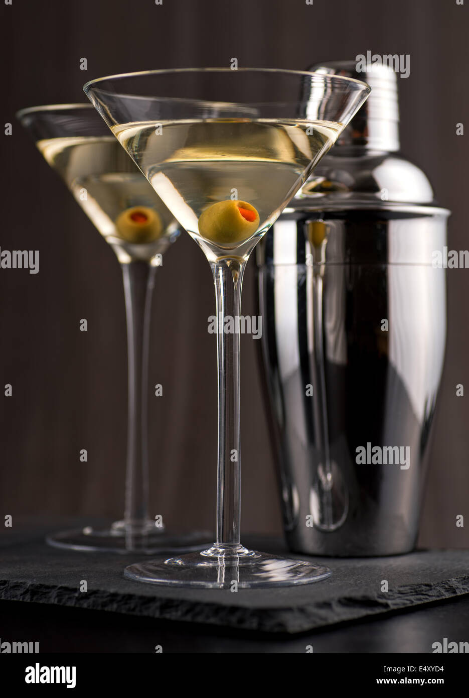 A traditional wet martini with olive and cocktail shaker Stock Photo ...