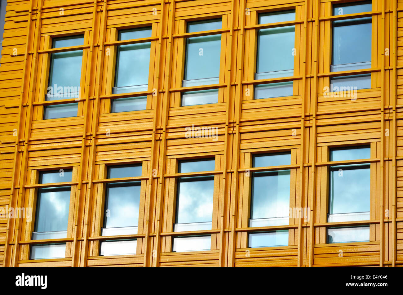 Yellow Building with windows Stock Photo - Alamy
