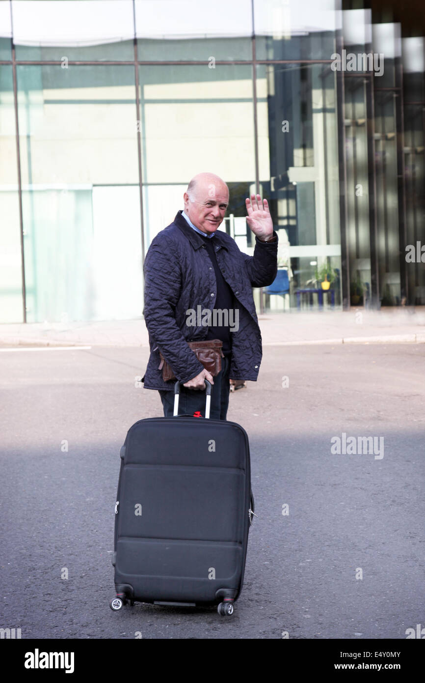 Man waving goodbye hi-res stock photography and images - Alamy