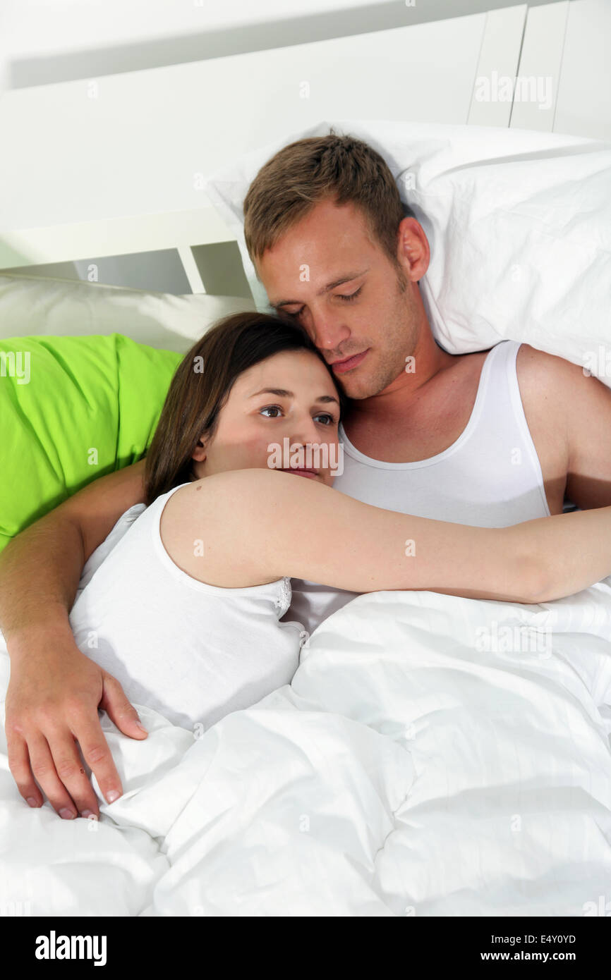 Romantic couple kissing in bed hi-res stock photography and images - Alamy