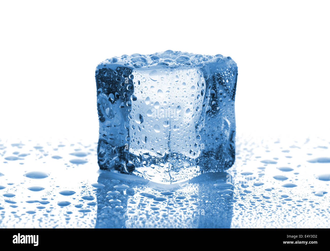 Single melted ice cube Stock Photo - Alamy