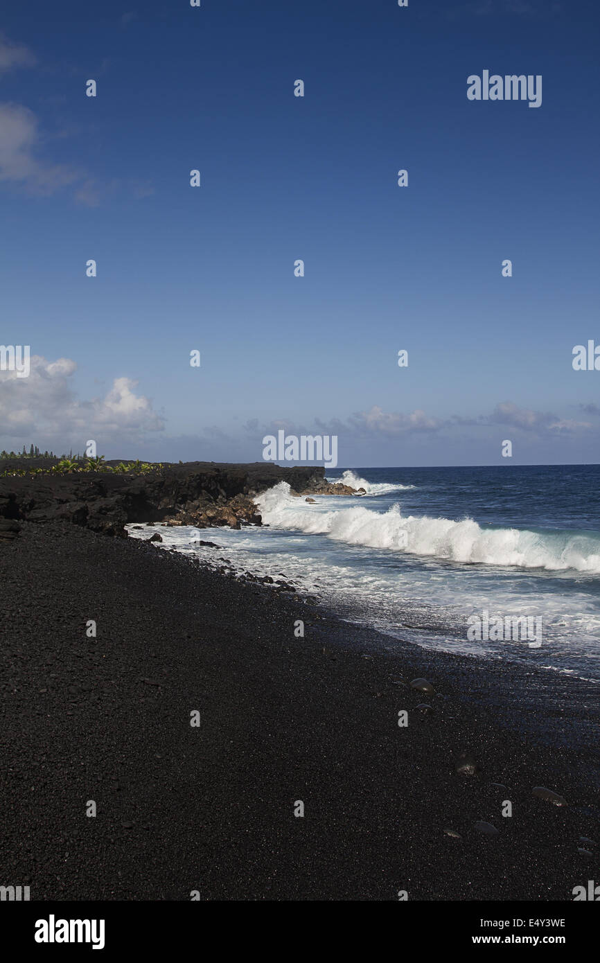 Low tide at black beach Stock Photo - Alamy