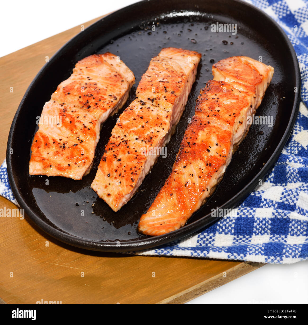 Fried Salmon Fillets In A Iron Platter Stock Photo - Alamy