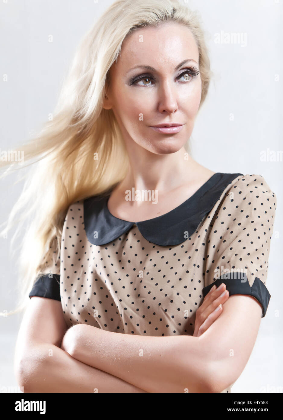 girl in a beige dress Stock Photo - Alamy