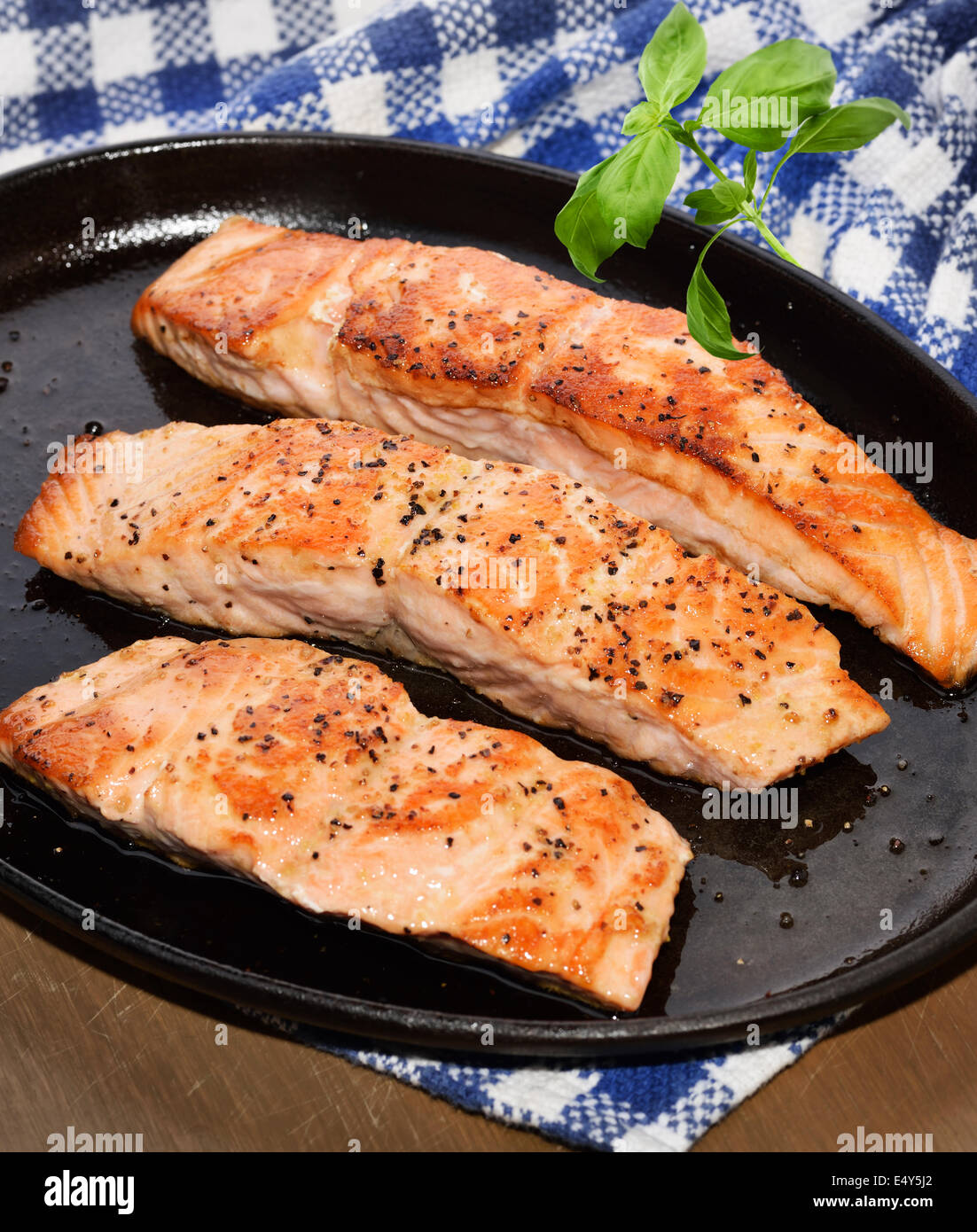 Fried Salmon Fillets In A Iron Platter Stock Photo - Alamy