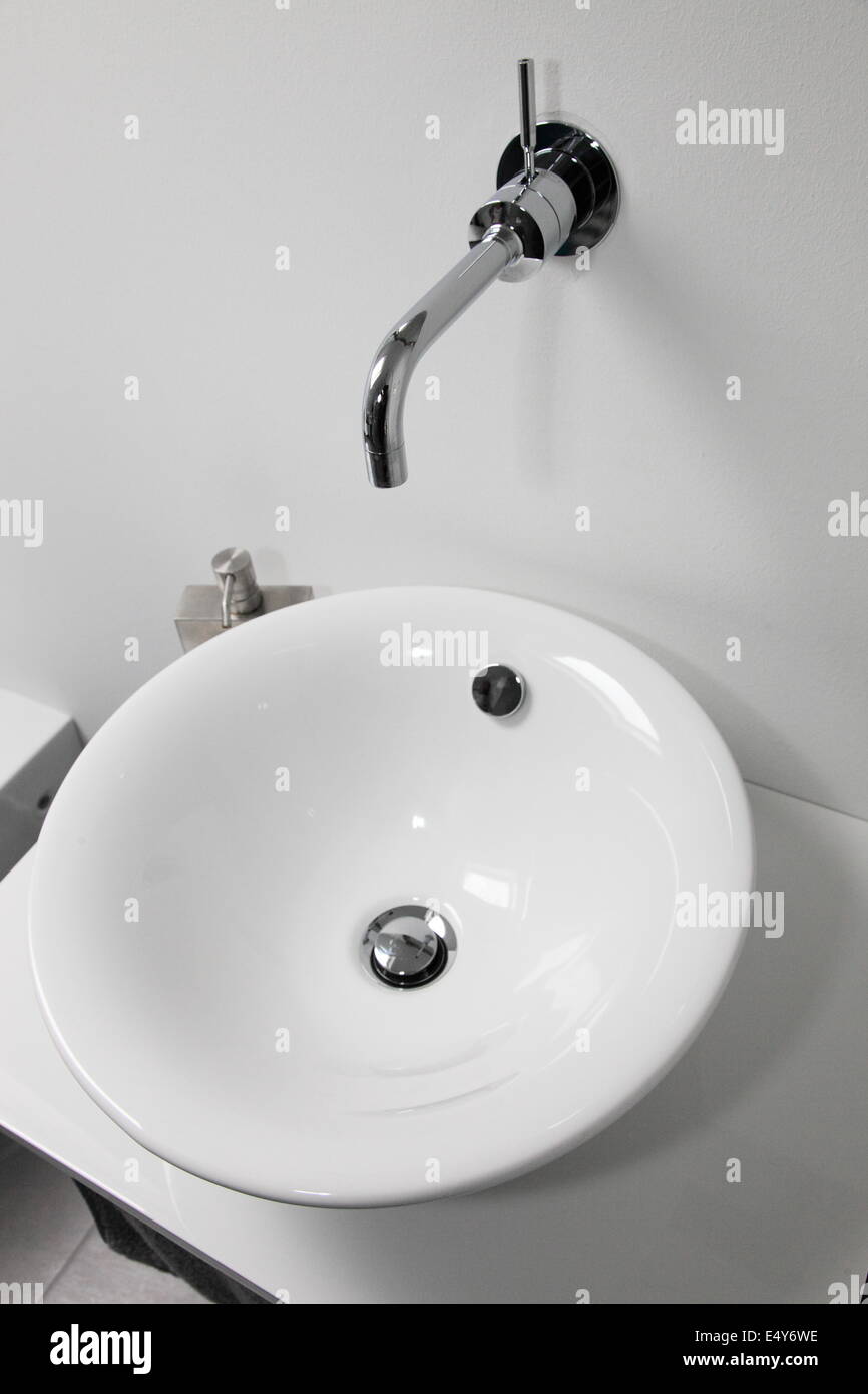 Modern handbasin and tap Stock Photo - Alamy