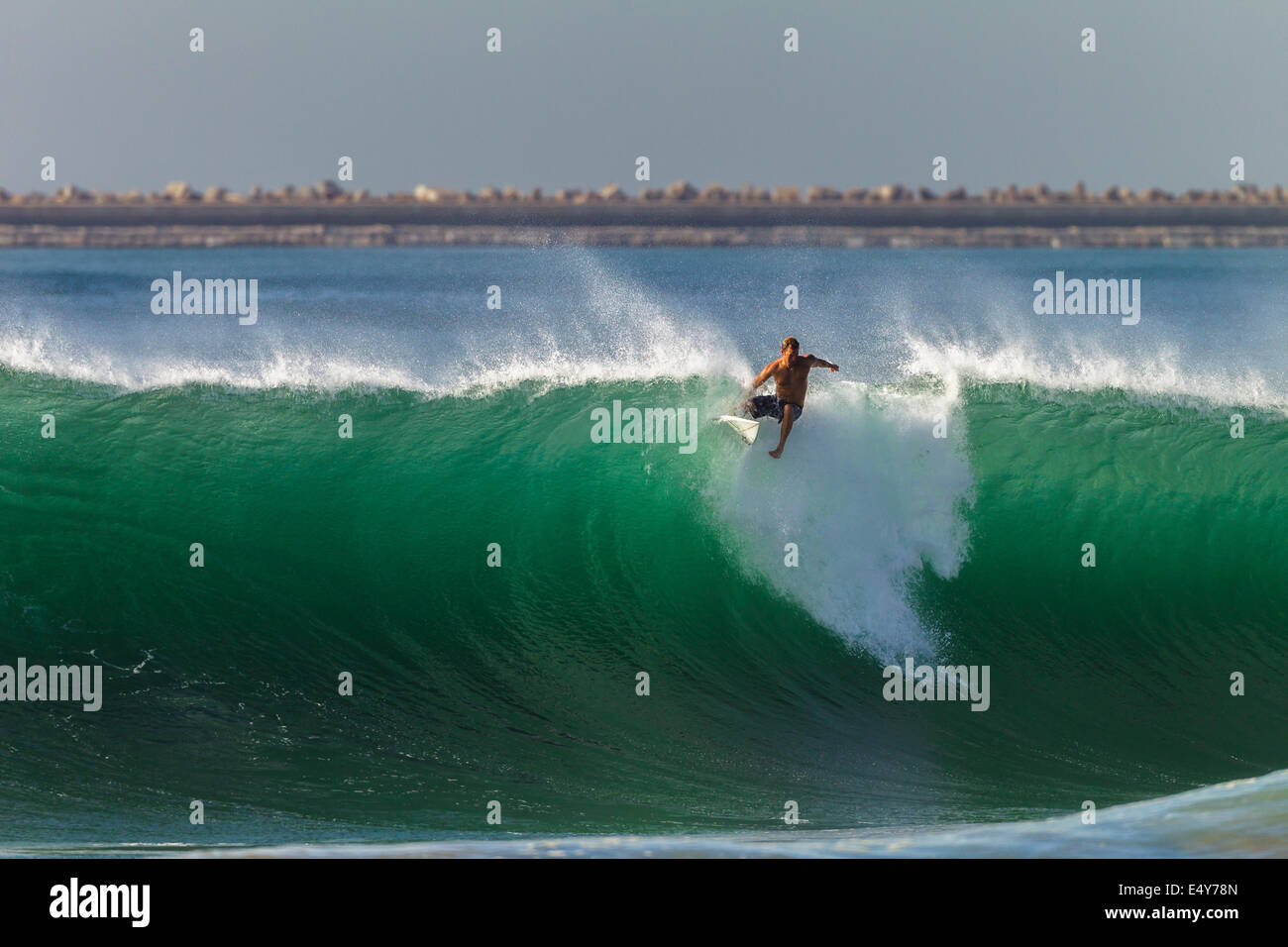 Surfer crashing falling wipeout surfing large ocean wave Stock Photo ...