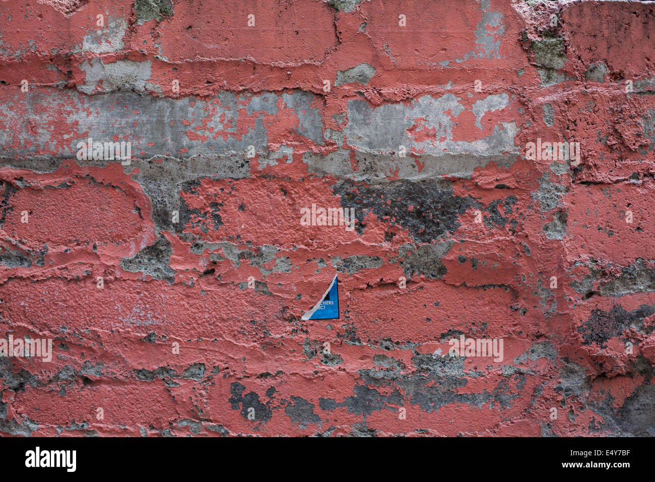 Old brick wall with remains of salmon pink red paint Stock Photo - Alamy