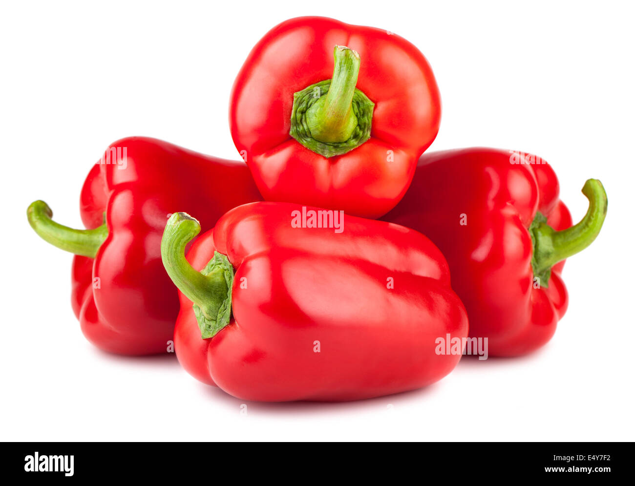 Four red ripe peppers Stock Photo - Alamy