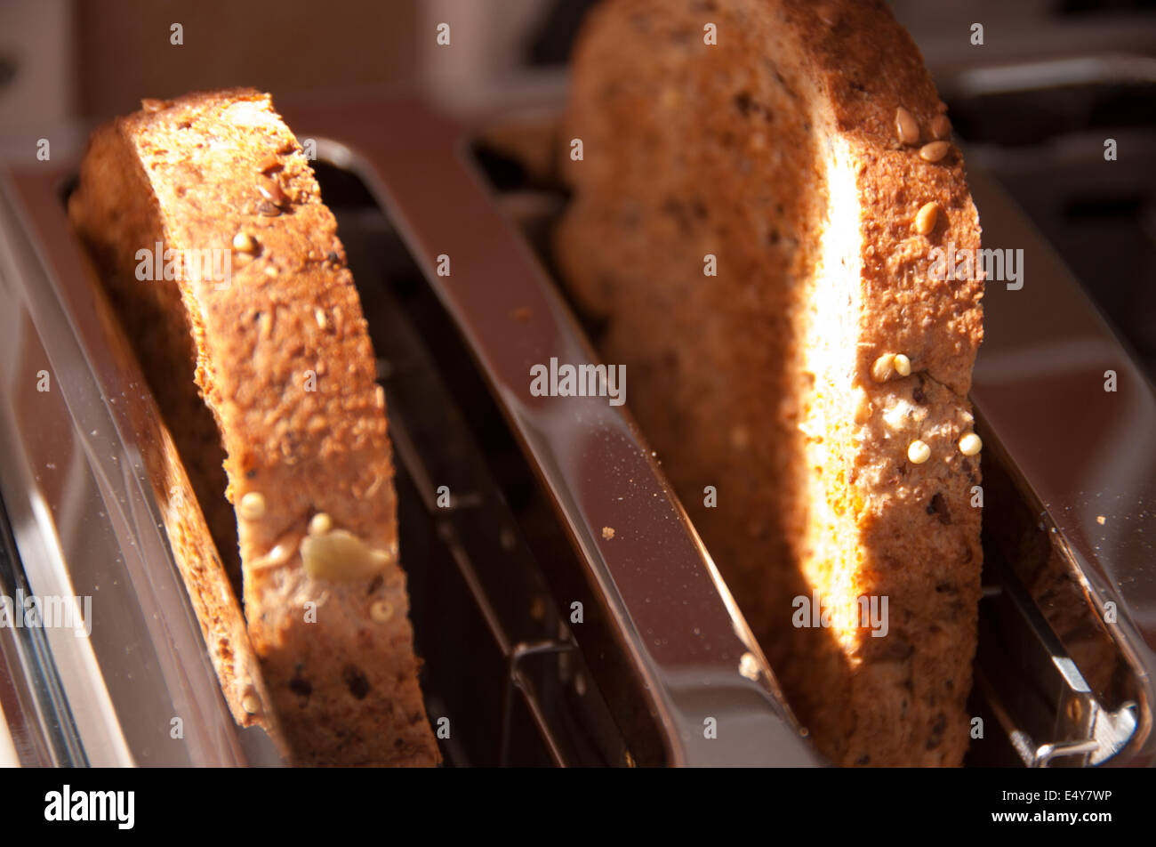 Toast popping up in a toaster for morning breakfast Stock Photo - Alamy