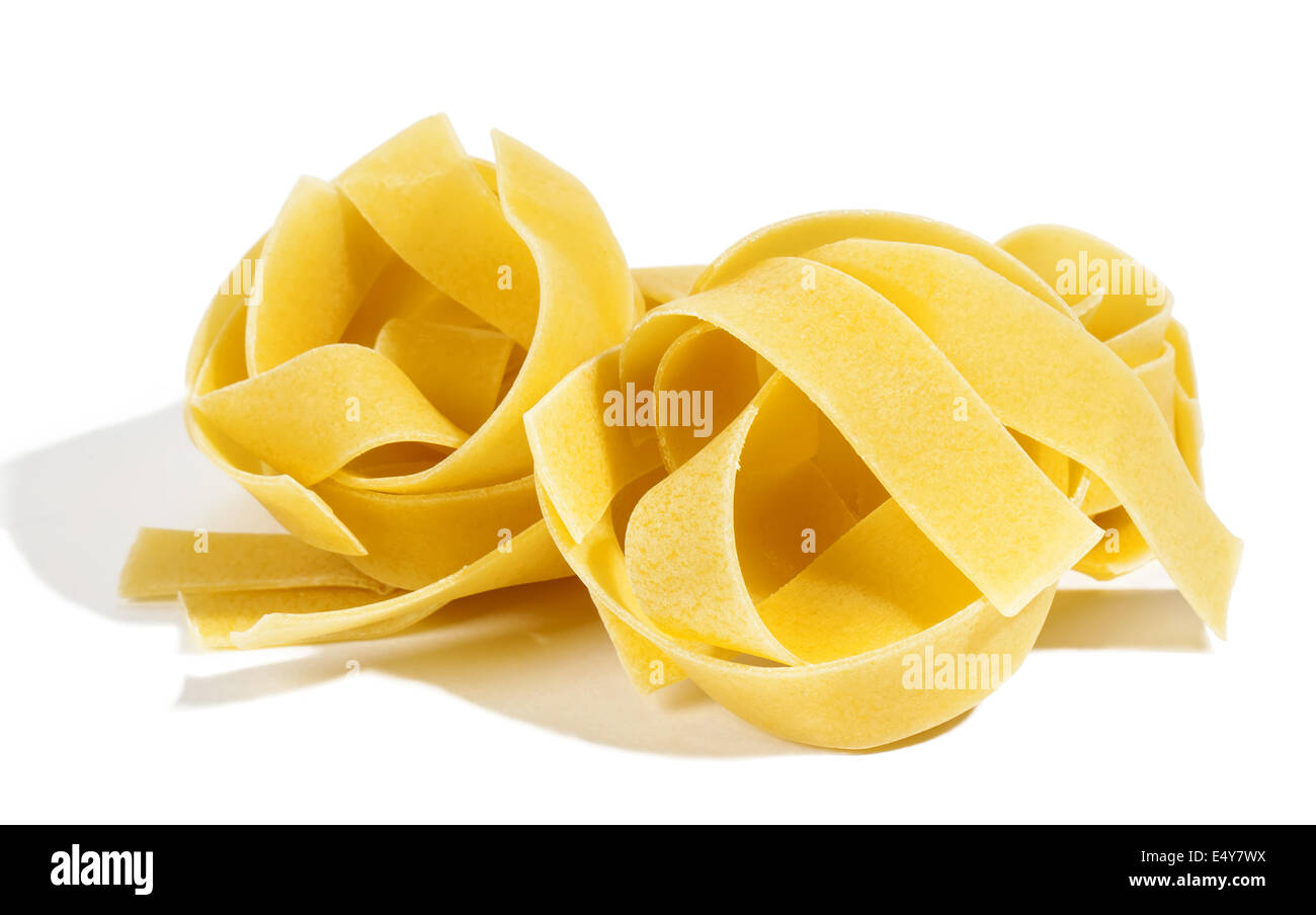 Raw pasta isolated on white Stock Photo - Alamy