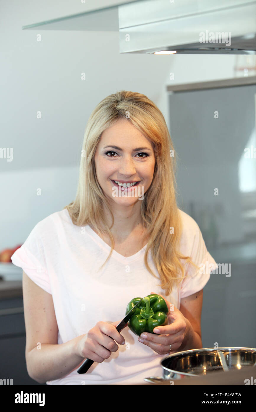 Happy woman dicing food hi-res stock photography and images - Alamy