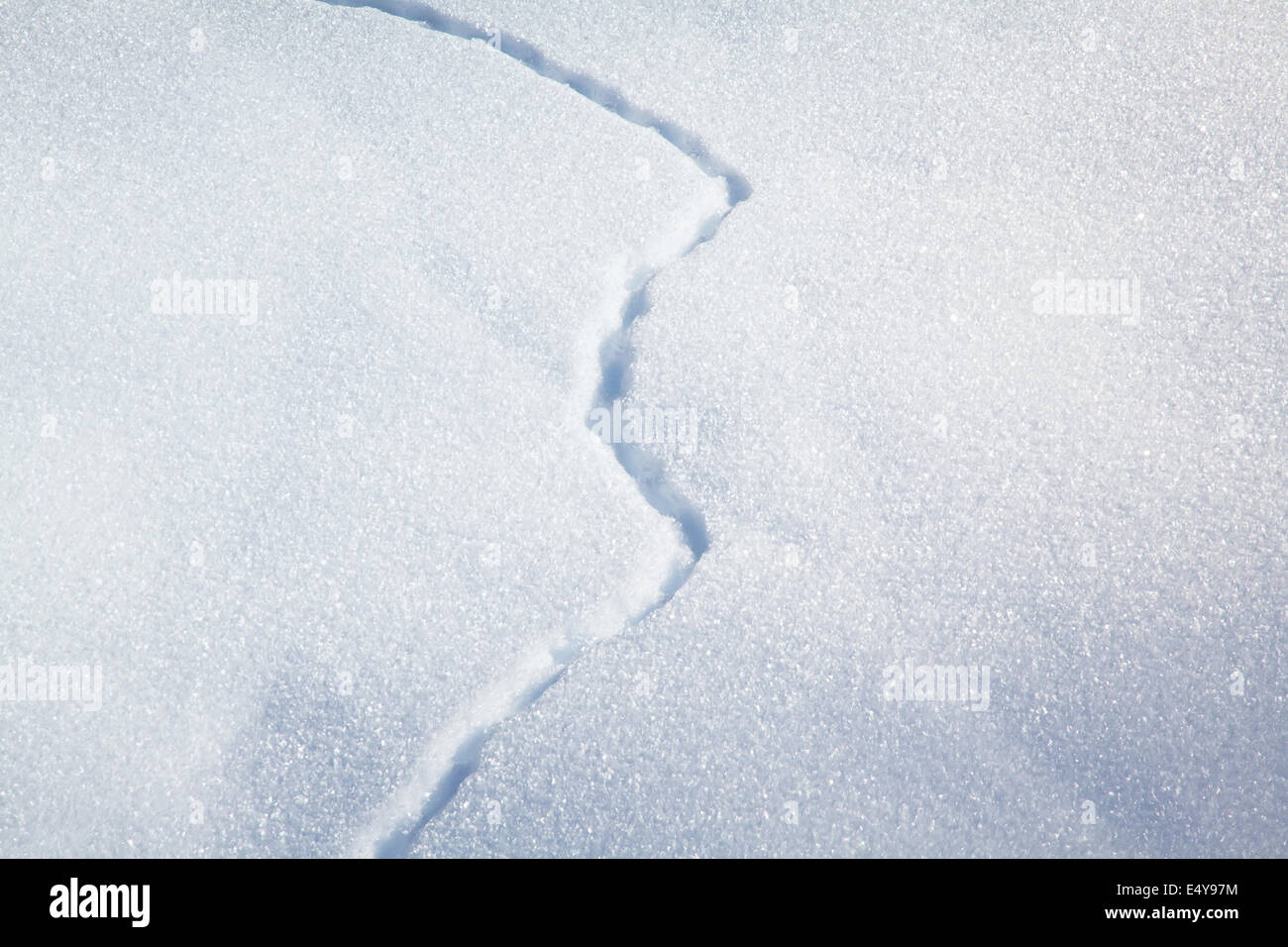 Cracked snow background Stock Photo - Alamy