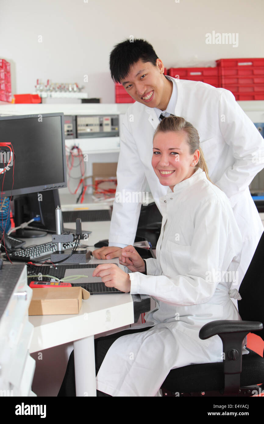 Two technicians at work in a laboratory Stock Photo - Alamy