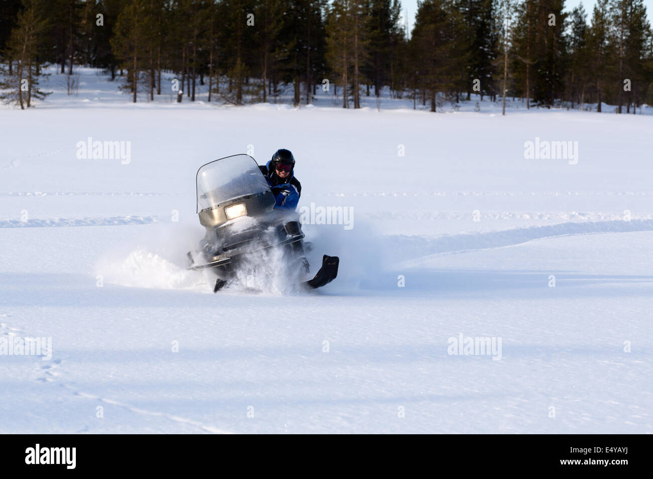 Man driving snowmobile hi-res stock photography and images - Alamy