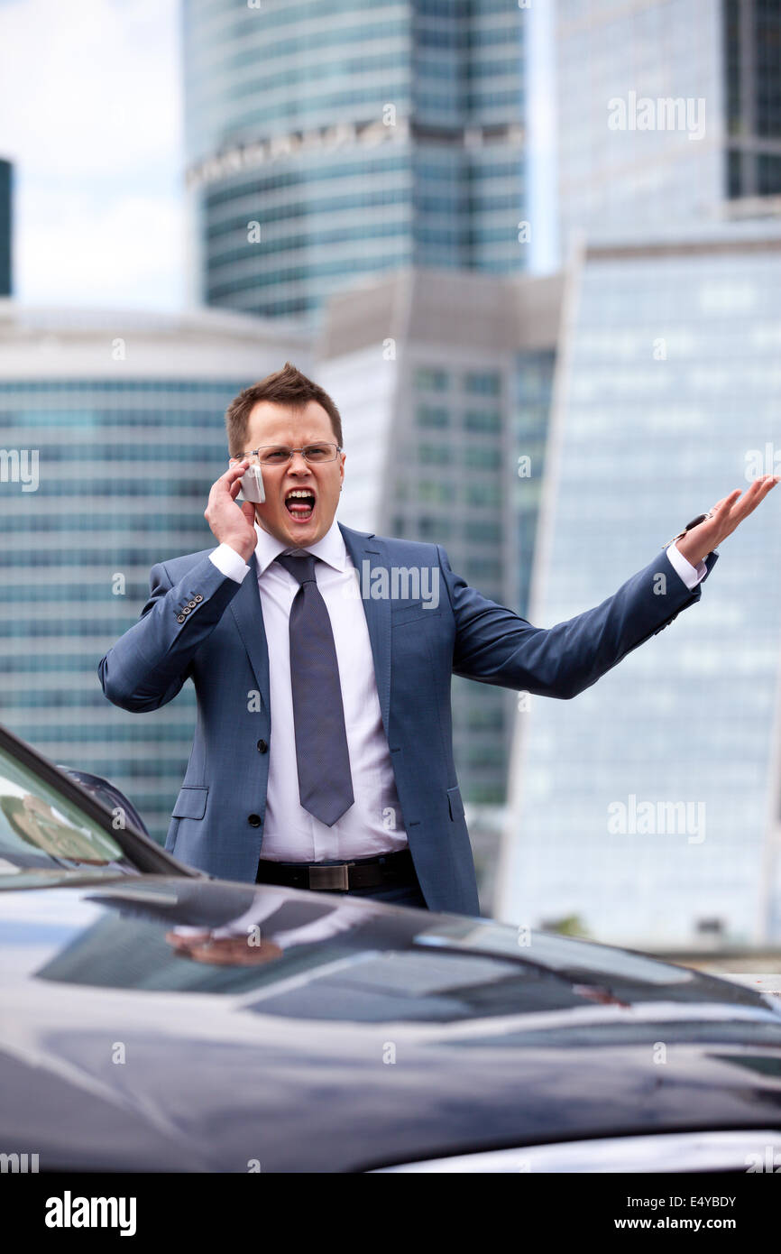 businessman shouting into the phone Stock Photo - Alamy