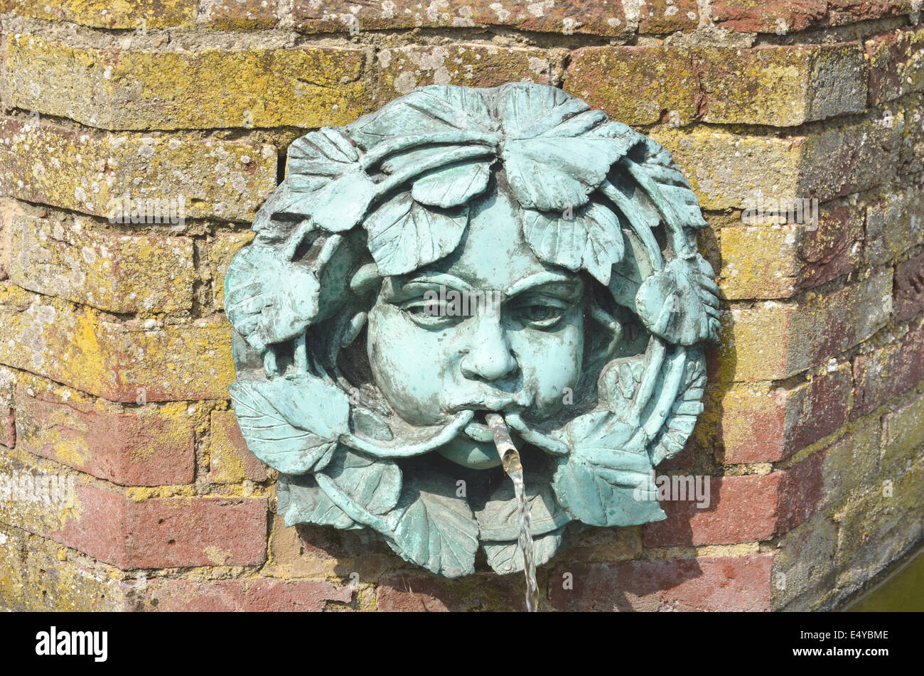 Face in water feature detail Stock Photo - Alamy