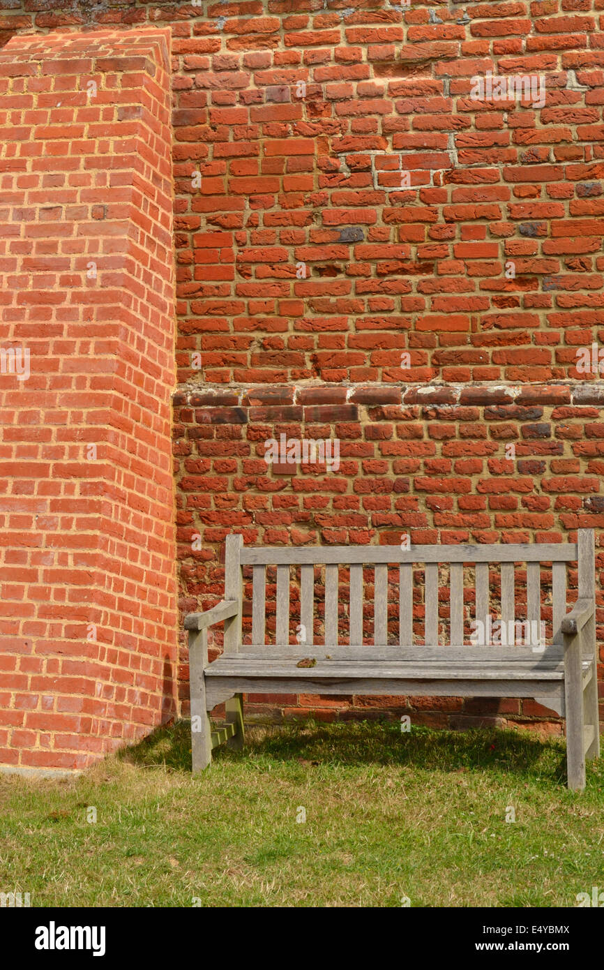Brick wall with bench Stock Photo - Alamy
