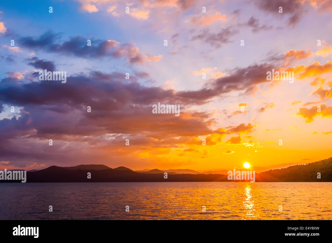 Sunrise over hills water hi-res stock photography and images - Alamy