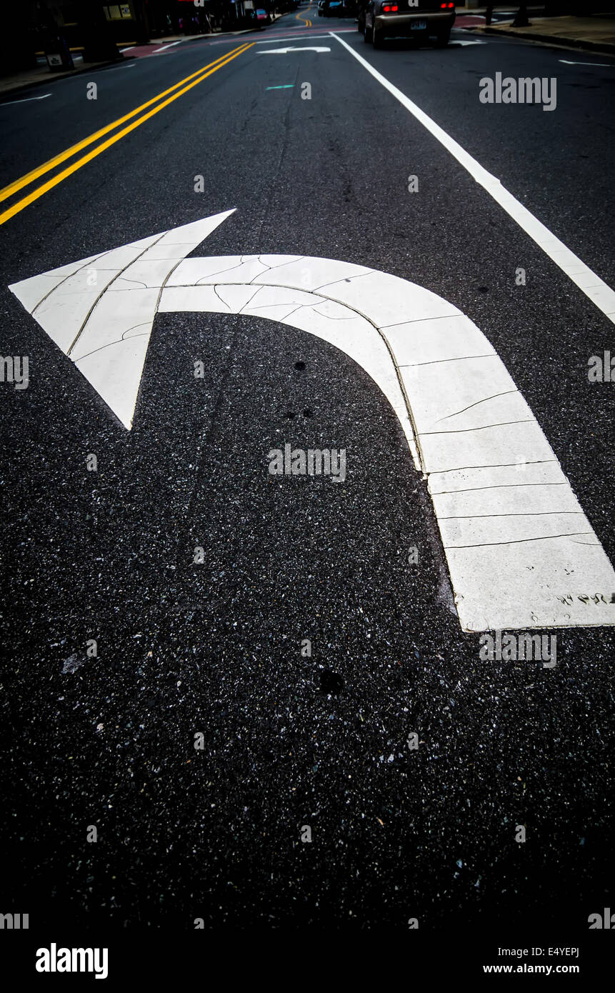 painted direction arrow on pavement Stock Photo - Alamy