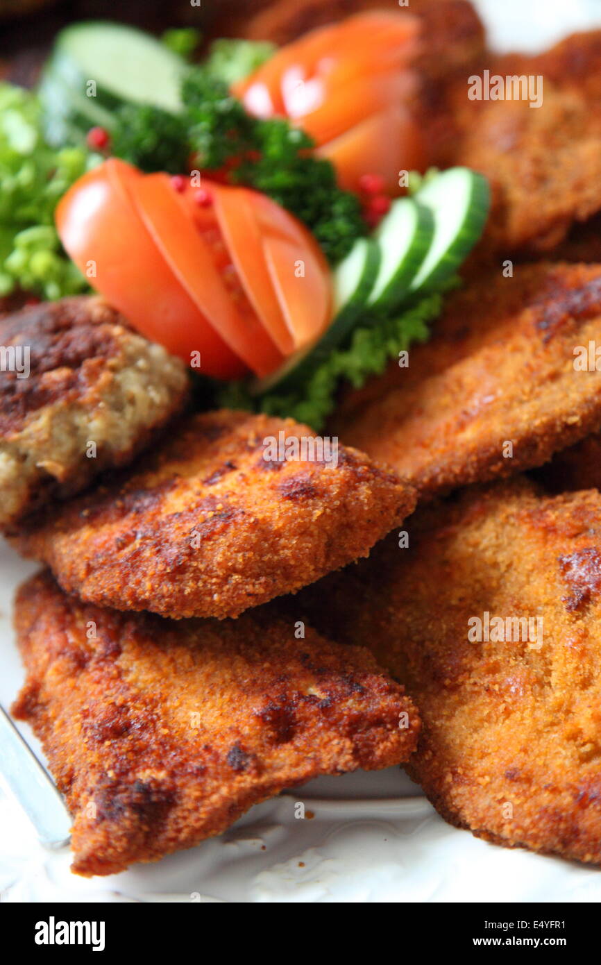 Crumbed meat on a buffet table Stock Photo - Alamy
