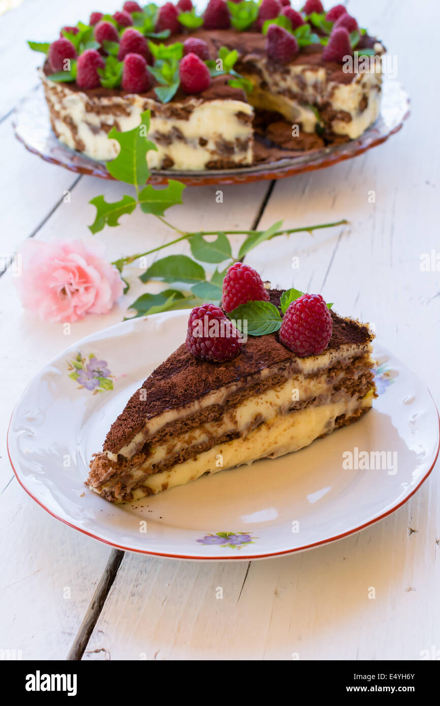 Delicious homemade cake garnished with raspberries and mint leaves ...
