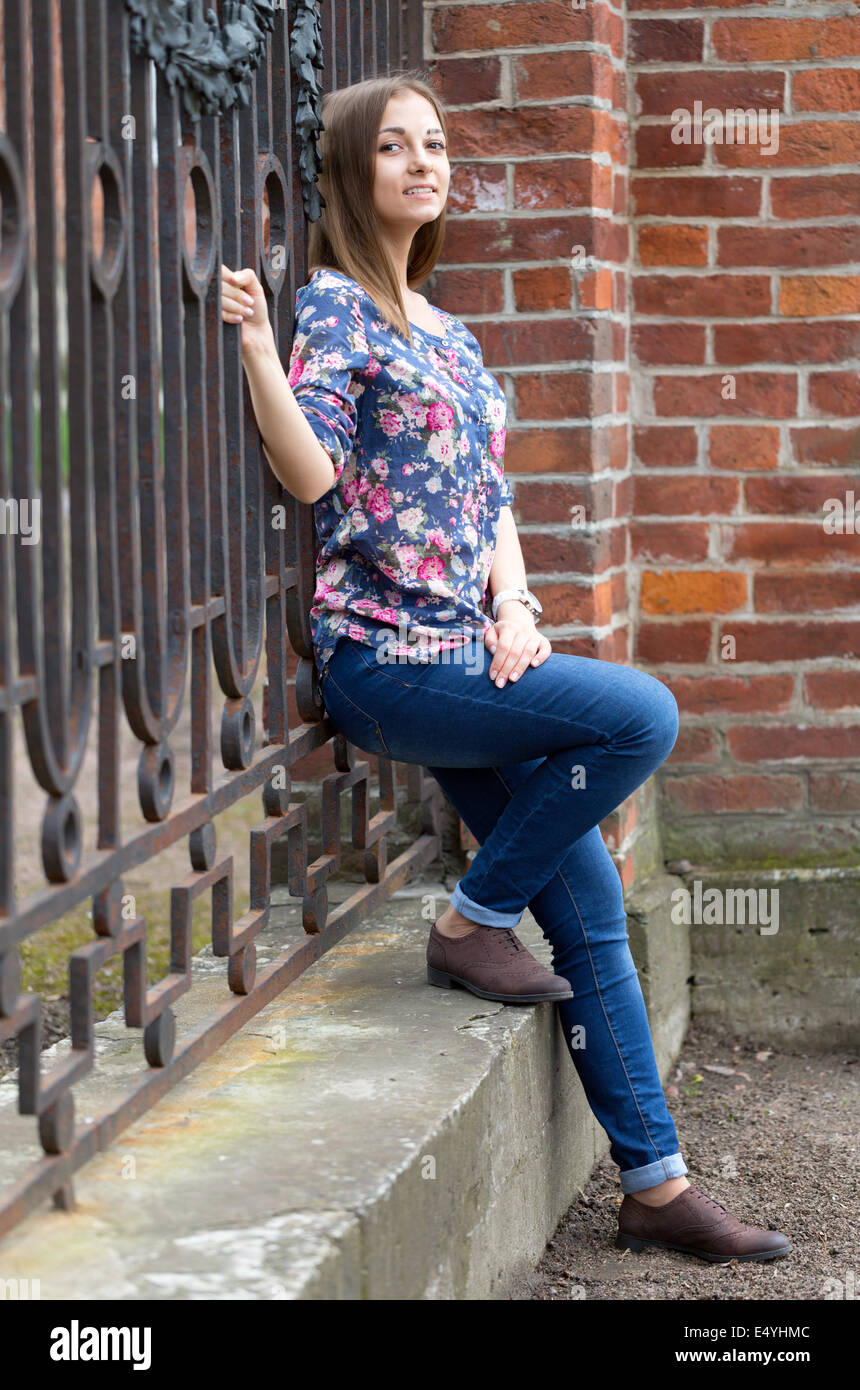 Full-length portrait of a pensive girl Stock Photo - Alamy